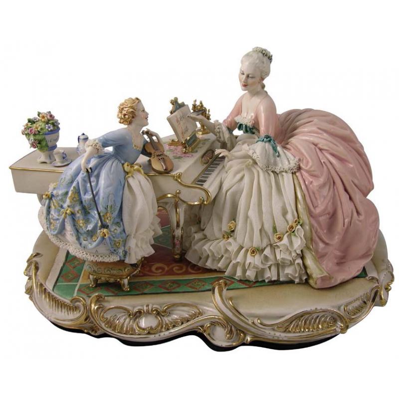 Italian porcelain figurine of woman at a piano
