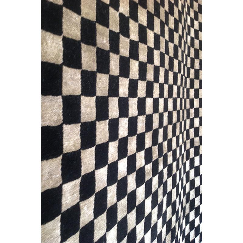 Wool and bamboo fabric carpet in a white and black chess board pattern